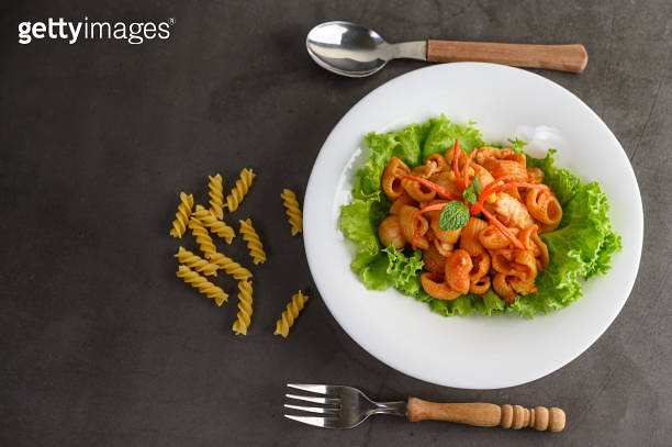 The pipe rigate italian pasta with tomato sauce and egg, chili and ...