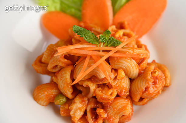 The pipe rigate italian pasta with tomato sauce and egg, chili and ...