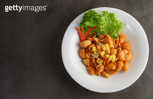Top view and close up of pipe rigate italian pasta with tomato sauce ...