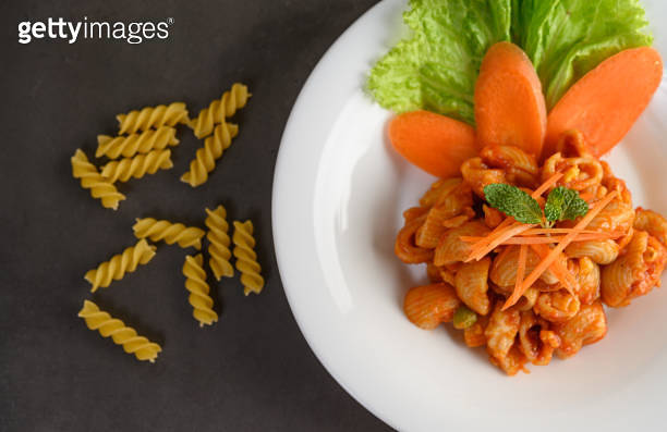 The pipe rigate italian pasta with tomato sauce and egg, chili and ...
