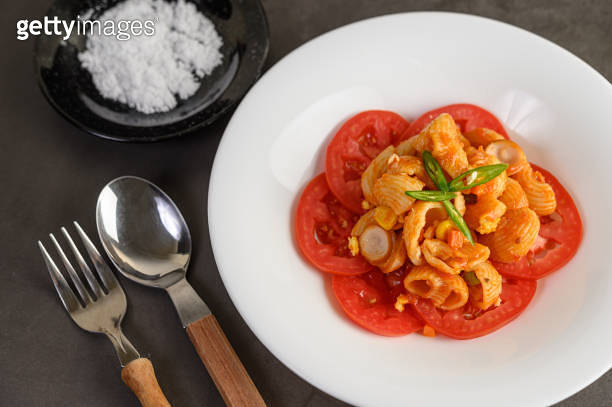 The pipe rigate italian pasta with tomato sauce and egg, chili and ...