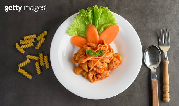 The pipe rigate italian pasta with tomato sauce and egg, chili and ...