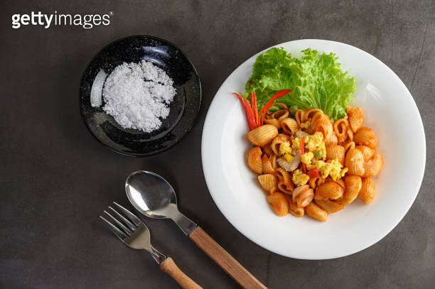 Top view the pipe rigate italian pasta with tomato sauce and egg, chili ...