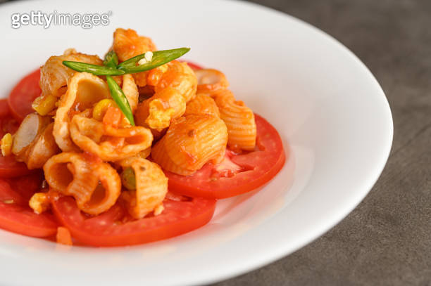 The pipe rigate italian pasta with tomato sauce and egg, chili and ...