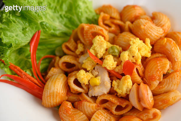 The pipe rigate italian pasta with tomato sauce and egg, chili and ...