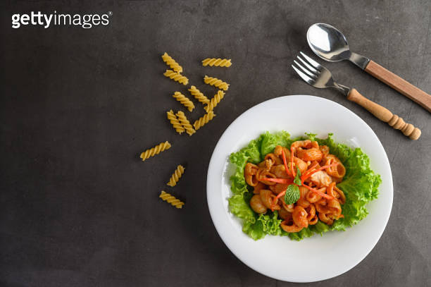 The pipe rigate italian pasta with tomato sauce and egg, chili and ...