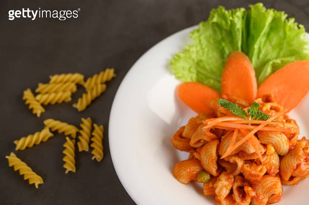 The pipe rigate italian pasta with tomato sauce and egg, chili and ...