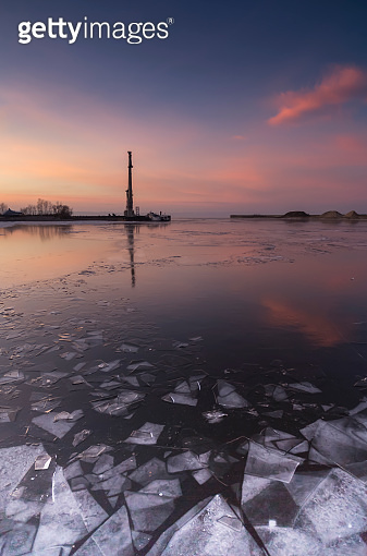 Ice on the river. Winter. Beautiful sunset sky. Reflections of the sky ...