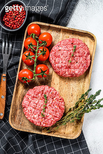 The ground beef patties, minced meat cutlets. Gray background. Top view ...