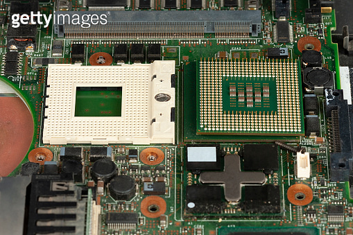 Close up of laptop processor with empty socket base for CPU on main ...