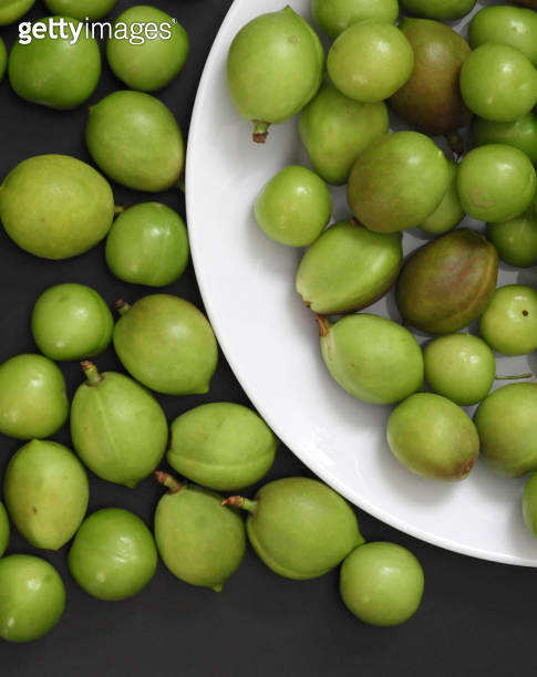 close-up shooting raw nectarine and sour plum,first sour fruits in ...