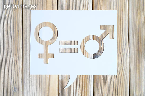 male and female symbols and an equal sign in white dialogue box cut out ...