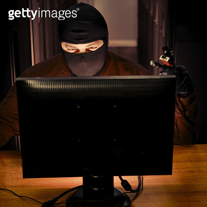 Hacker near server equipment in hand with wires for hacking. Concept of ...
