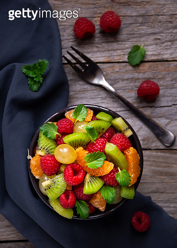 Fresh fruit salad with with raspberry, mandarin and other fruit ...
