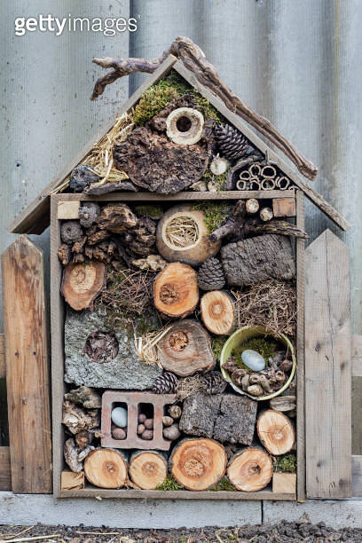 Handmade Bee Hotel made from recycled second materials at hand. a ...