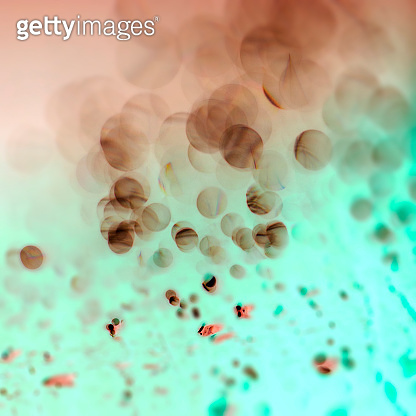 Brown circular organic cells rising and expanding from green ground ...