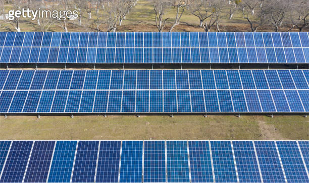 Blue panels of solar power plant in the backyard. Energy independence ...
