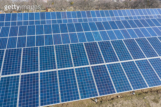 Blue panels of solar power plant in the backyard. Energy independence ...