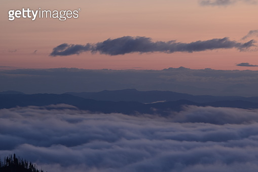 Dramatic Inverted Clouds With Mountain Ridges In The Distance Against ...