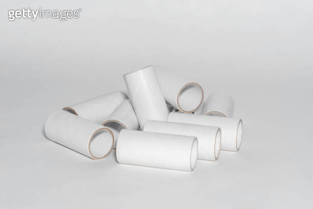 Paper tube cores, tissues isolated on white background, in industry ...