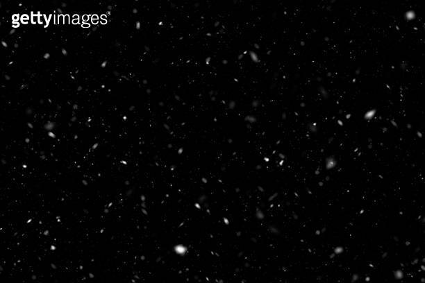 Snow or snowflake storm falling. White dots falling powder glitter ...