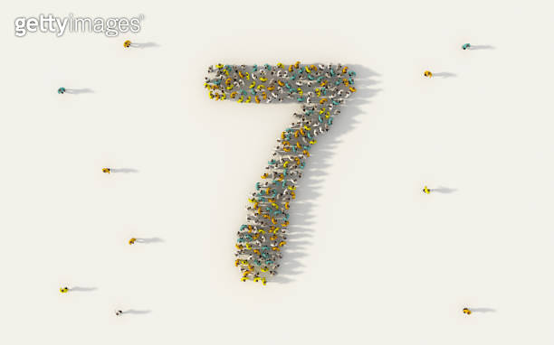 Large group of people forming number seven, 7, alphabet text character ...