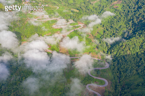 Aerial view of cars driving on curved, zigzag curve road or street on ...