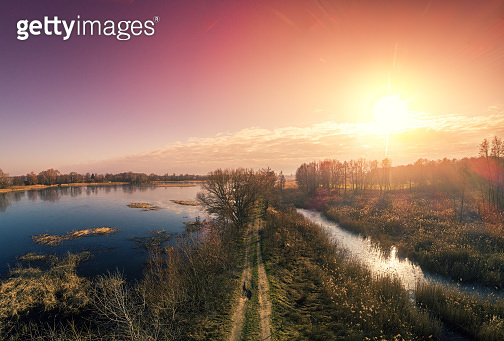 Magical sunrise over the lake in spring. Serene lake in the early ...