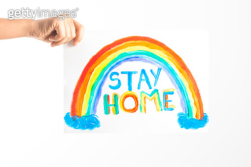 Kid hand holding drawing picture with colorful rainbow and words Stay ...