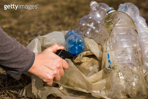 Flames and smoke burn plastic waste to pollute the air (1210110568 ...