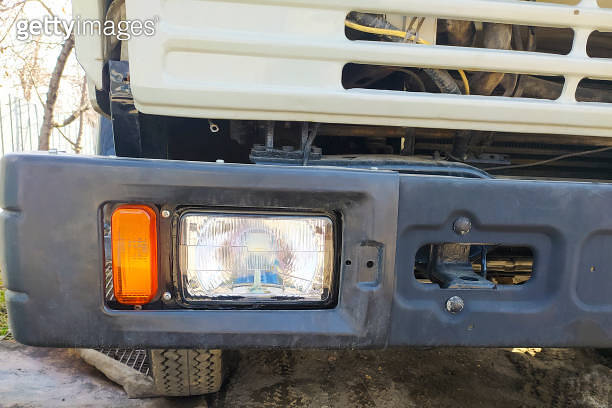 Different parts of a big truck. Headlight and bumper. Car repair. 이미지 ...
