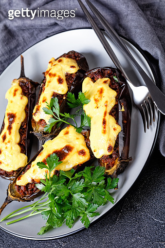 Papoutsakia dish of greek cuisine: baked stuffed eggplants with beef ...