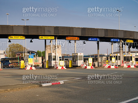 Toll gates at the entrance to the Queensway road tunnel between ...