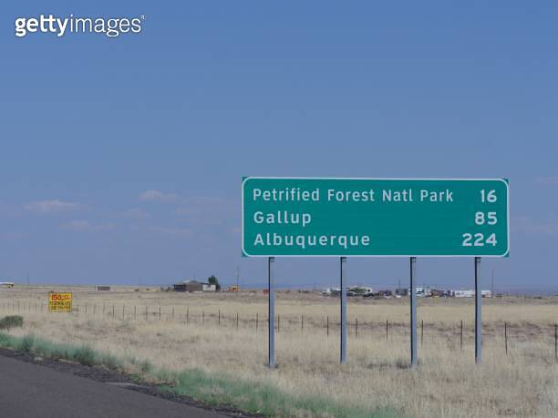 Directional sign on the road in Arizona with distance information to ...