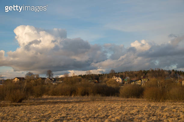 View of village from field of Klin-Dmitrovsky ridge in early spring ...
