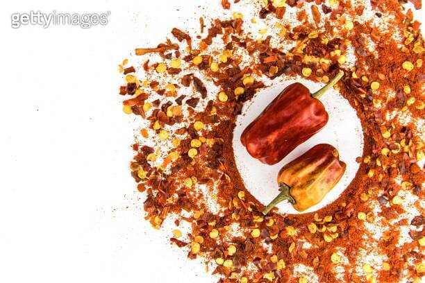 Hot spice. Chilli powder. Dried chili. Healthy spices. Spilled chili on ...