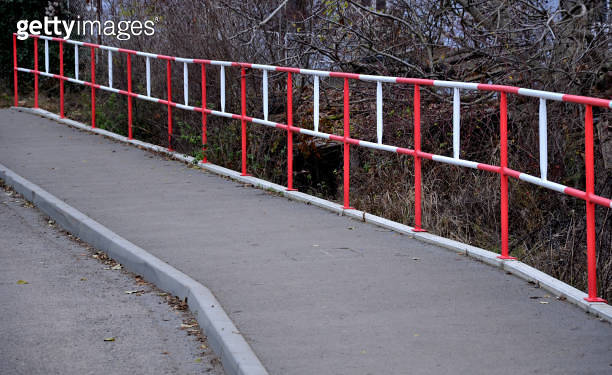 metal safety road railing at school. protects children from running ...