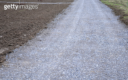 temporary gravel new dirt road. securing the slope against erosion at ...
