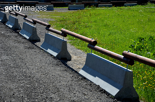 concrete roadblock used on the highway between two lanes and driving ...