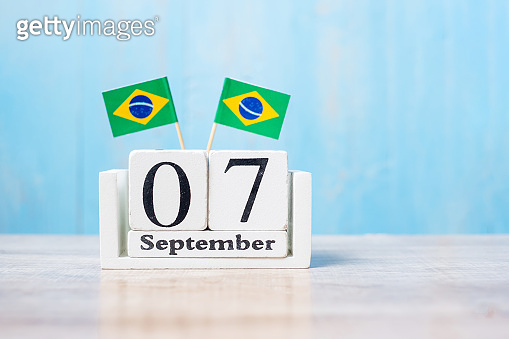 Wooden calendar of September 7th with miniature Brazil flags ...