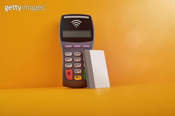 Wireless, contactless credit card reader and a card leaning against the ...