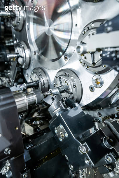 Mechanical industry machinery: inside of a modern multi-spindle CNC ...