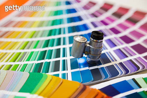 Open color palette swatches with magnifying glass. Close-up (1254415650 ...