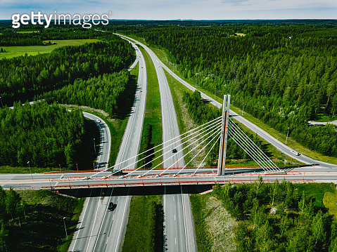 Aerial top view of cable-stayed Suspension bridge and Highway road with ...