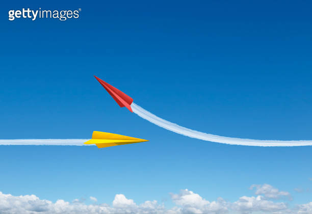 Ascending Paper Airplane Moves Out Of The Way Of Oncoming Airplane ...