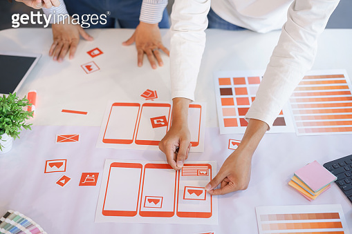 Creative ux ui designers designing screens for mobile responsive ...