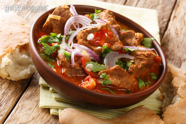 Chashushuli is a traditional Georgian beef stew with tomato sauce close ...