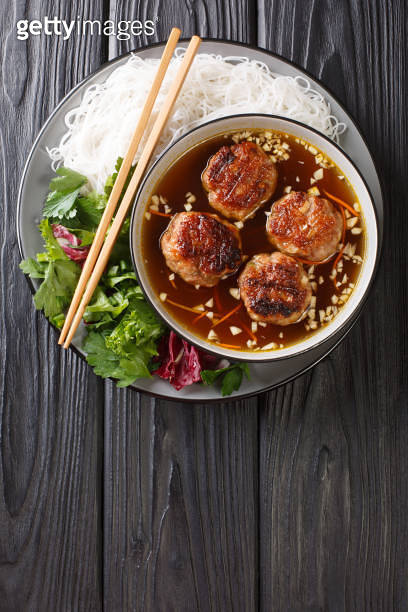 Bun cha consists of rice vermicelli noodles (bun), grilled pork (cha ...