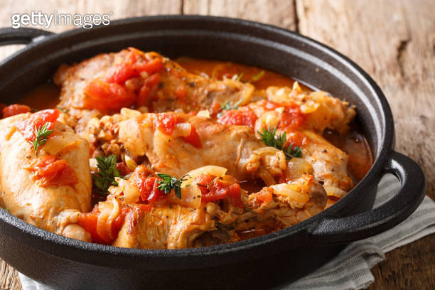 Cunillo stew of rabbit in tomato sauce with white wine and herbs close ...