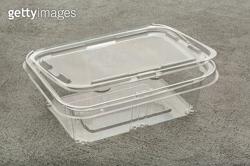 Disposable plastic transparent lunch box on a gray background. 이미지 ...